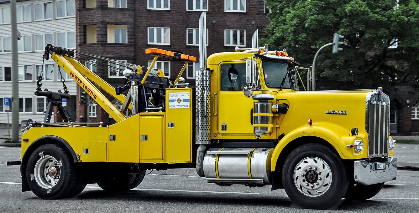 The Role of Hook and Chain Tow Trucks in Vehicle Recycling - OK Towing ...